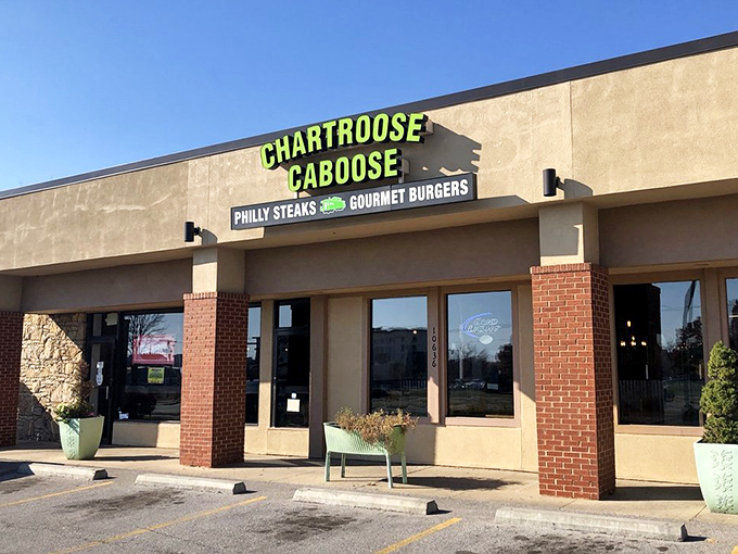 The chartreuse sign glows like a beacon for hungry travelers. Follow it to find sandwich salvation in suburban Kansas.