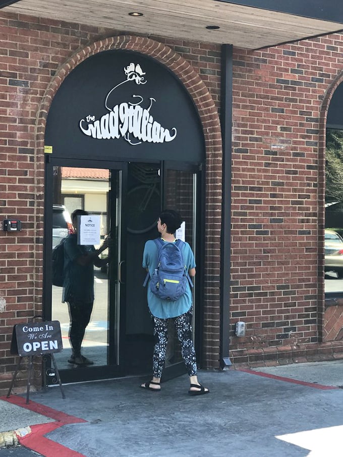 The entrance beckons like a portal to sandwich paradise&mdash;just follow the aromatic breadcrumb trail of grilled onions and melted cheese.