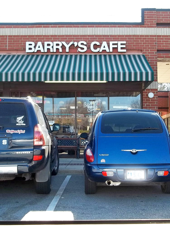 That green awning acts like a beacon for breakfast enthusiasts, with cars parked out front containing people who know exactly what awaits inside those doors.