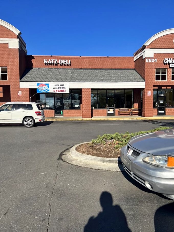 A celebration banner announces five years of bringing authentic deli flavors to Charlotte - that's a lot of matzo balls and happy customers.