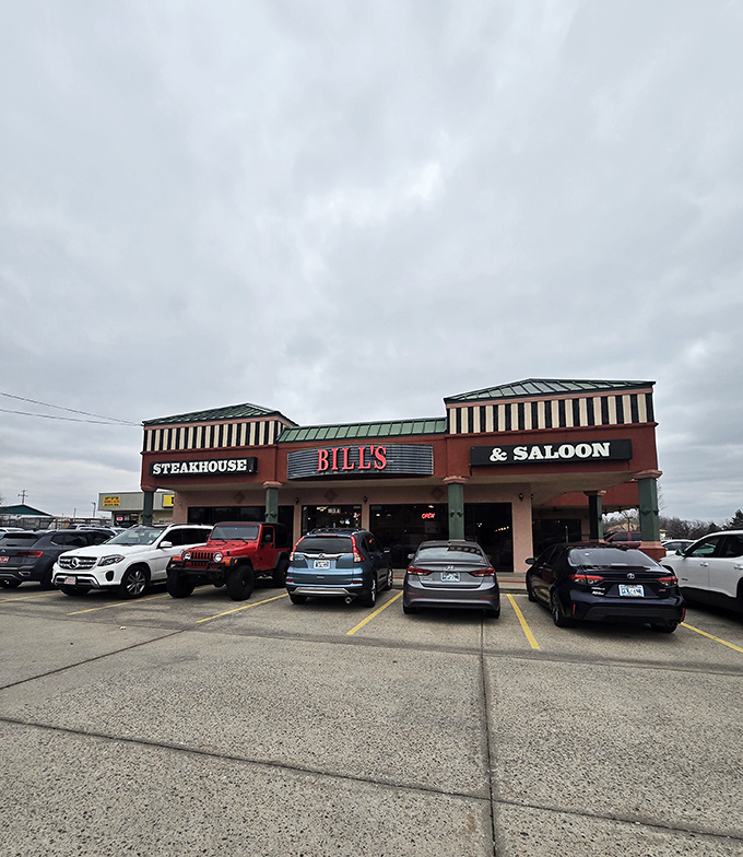 By daylight, Bill's Steakhouse & Saloon South might look unassuming, but locals know better – this parking lot fills up faster than a tornado shelter during storm season.