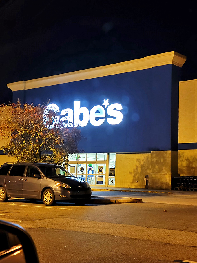 Even at night, the Gabe's glow promises tomorrow's treasures. The parking lot fills with hopeful hunters drawn to the blue beacon of bargains.