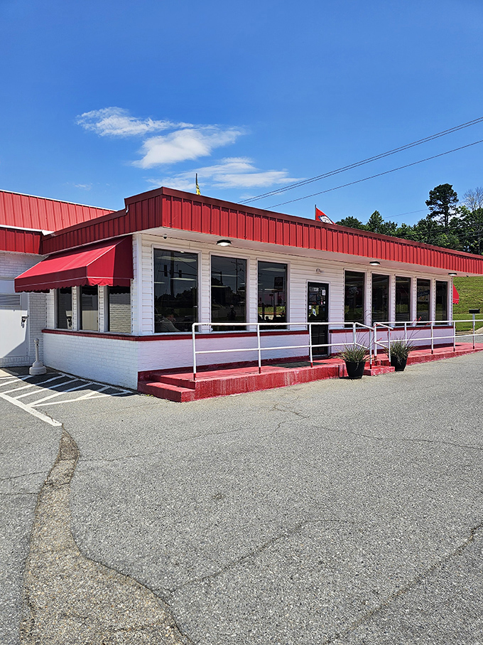 A pilgrimage site disguised as a humble roadside eatery. That red trim isn't just decoration; it's a beacon calling to serious burger enthusiasts everywhere.