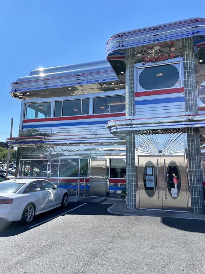 The neon "DINER" sign glows like a lighthouse for hungry travelers, promising safe harbor from a world of complicated food trends. 