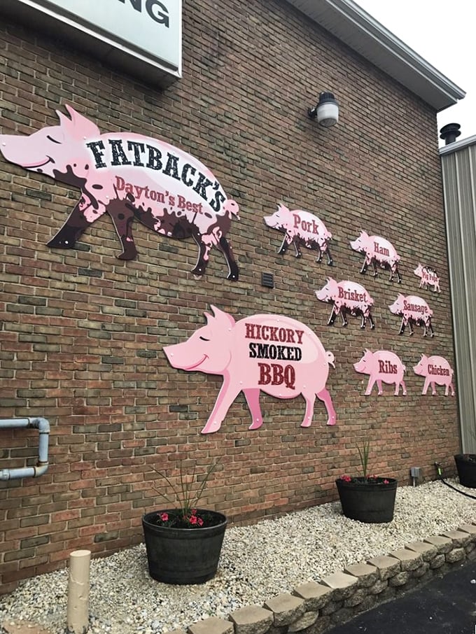 The pig parade on Fatback's exterior wall isn't just cute&mdash;it's a delicious warning of what awaits inside. Resistance is futile.