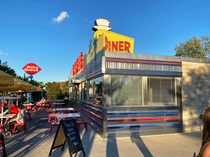 As the sun sets, that neon sign promises delicious refuge for weary travelers. Even the clouds look hungry hovering above this diner.