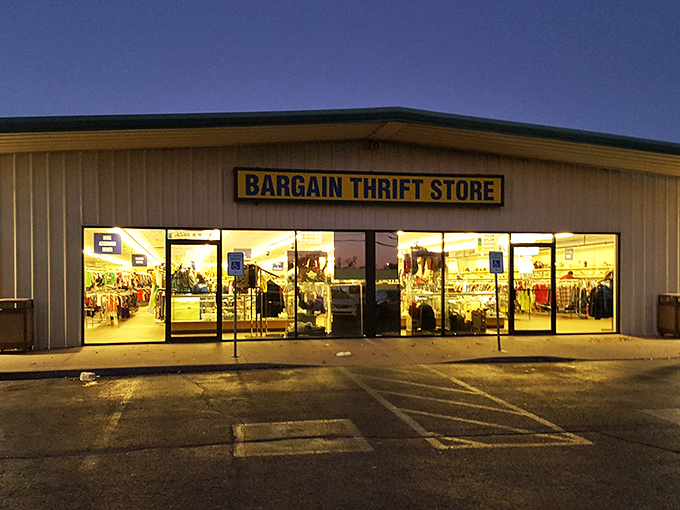 As evening falls, Bargain Thrift Store glows like a lantern of possibility, its windows showcasing silhouettes of merchandise waiting for tomorrow's treasure hunters.