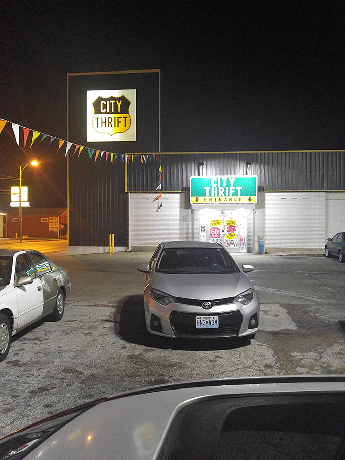 Even at night, City Thrift's glow beckons to late-evening treasure hunters. The illuminated sign serves as a lighthouse for those navigating the seas of secondhand shopping.