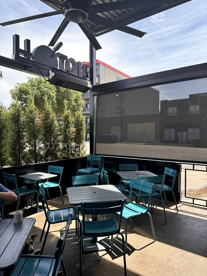 Outdoor dining with a side of urban charm. These turquoise chairs aren't just functional&mdash;they're little islands of calm in the city's morning rush.