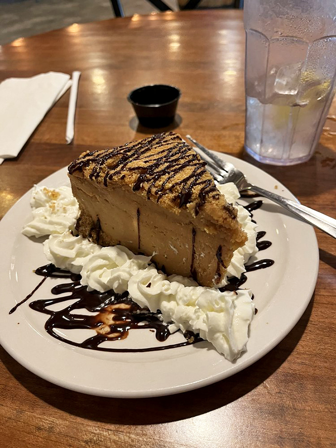 This peanut butter pie isn't dessert—it's therapy on a plate. The chocolate drizzle and whipped cream are just the support group for your taste buds.