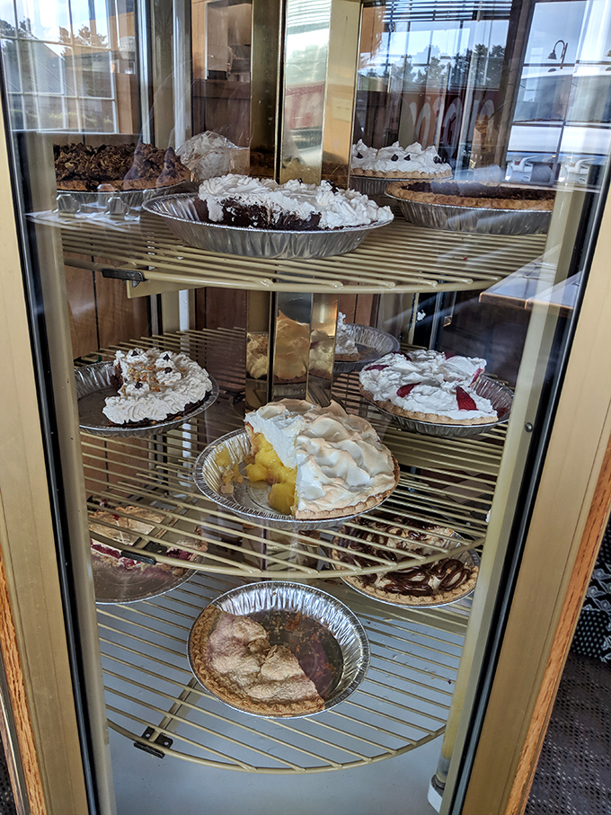 Elderly diners enjoying their meal by the window&mdash;proof that LeRoy's has been making breakfast memories for generations. 