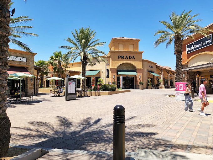 Prada in the desert sun&mdash;where luxury brands meet breathtaking mountain views in a surprisingly harmonious retail symphony.