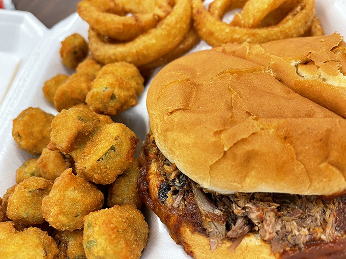 The pulled pork sandwich with fried okra&mdash;a combination so perfect it should have its own holiday. Arkansas in a single, glorious bite.