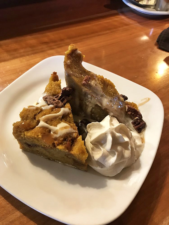 Pumpkin bread pudding that makes you question why anyone would ever choose another dessert. That whipped cream is just the encore. 
