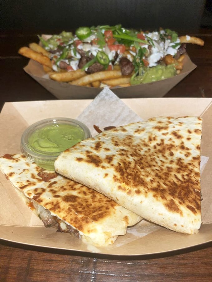 A quesadilla and loaded fries having a moment together. Name a more iconic duo—I'll wait.