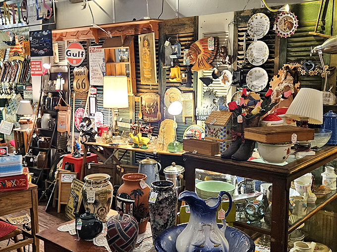 Vintage advertising signs, Native American artifacts, and delicate glassware create a visual symphony where Gulf Oil and Route 66 memorabilia transport you to America's golden age of travel.