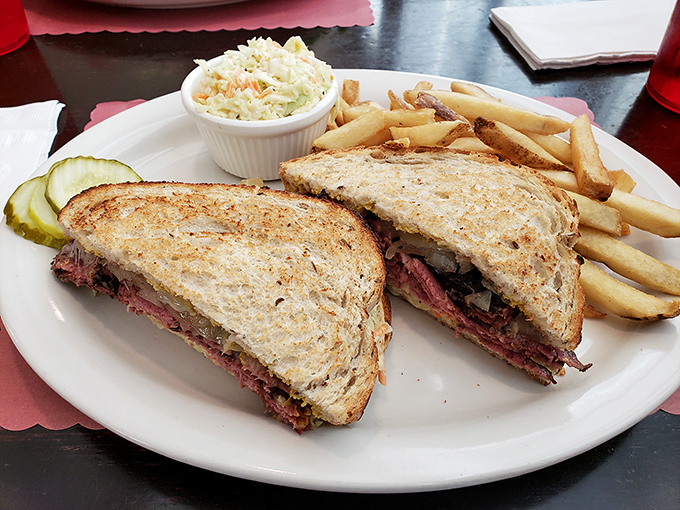 A sandwich cut in half not to make it easier to eat, but to let you admire the architectural marvel of perfectly stacked meat between toasted bread.