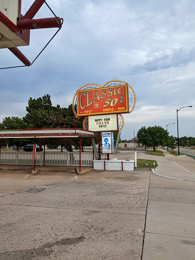Happy Hour advertised on a vintage sign that's weathered decades of Oklahoma seasons. Some landmarks don't need GPS coordinates&mdash;they need taste buds.