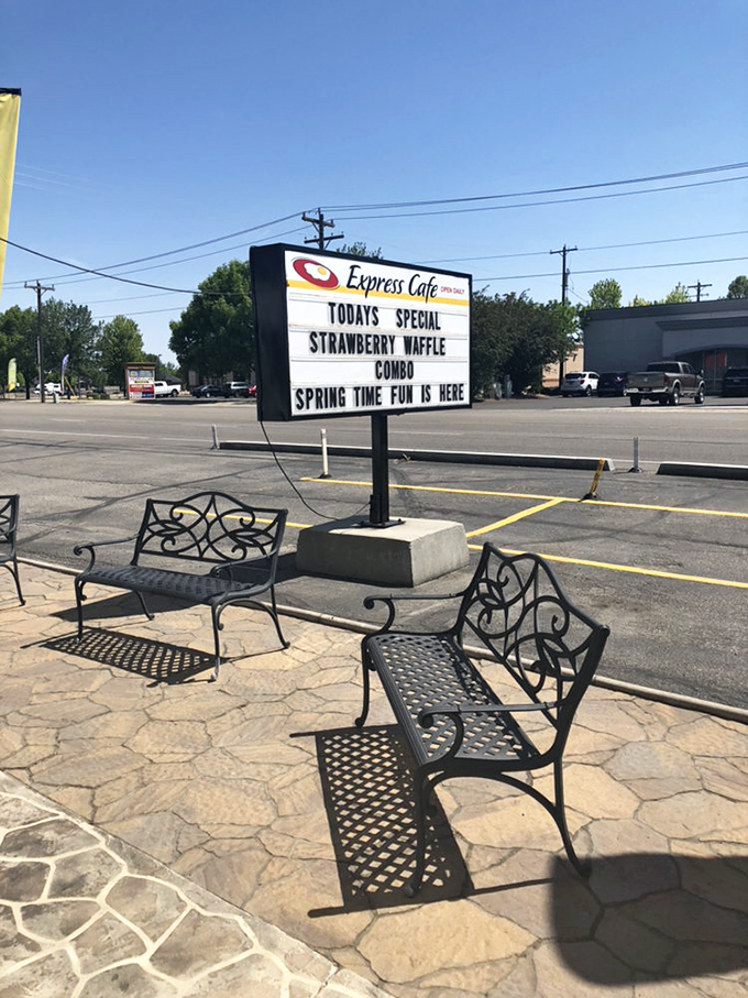 The roadside sign announces today's special like a town crier of deliciousness. Those benches outside aren't just seating &ndash; they're the waiting room for waffle heaven.