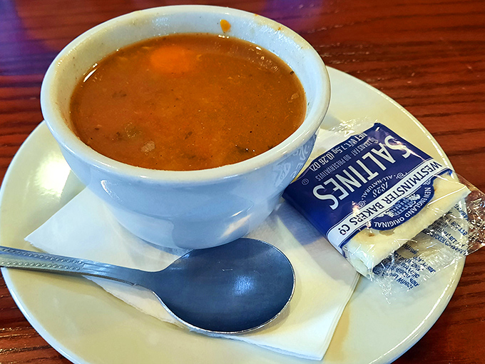 A cup of minestrone that proves soup isn't just a starter&mdash;it's a statement. Comfort in a cup with crackers on the side.