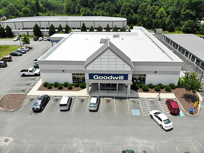 An aerial view reveals the impressive scale of this thrifting destination. The spacious parking lot welcomes a steady stream of donors and shoppers throughout the day.