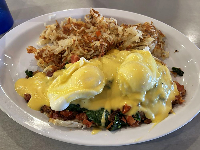 Those perfectly poached eggs beneath a river of hollandaise aren't just breakfast&mdash;they're performance art with spinach, bacon and tomatoes as supporting actors.