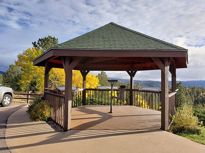 This gazebo viewpoint frames mountains like a masterpiece, proving sometimes the best way to see nature is through an architectural window.