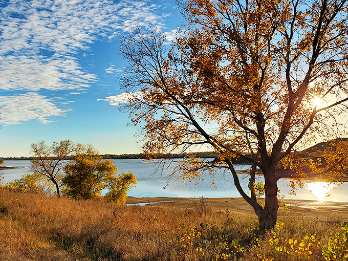 Golden hour perfection: As the sun dips toward the horizon, Kanopolis Lake becomes a mirror of amber light and endless possibility.
