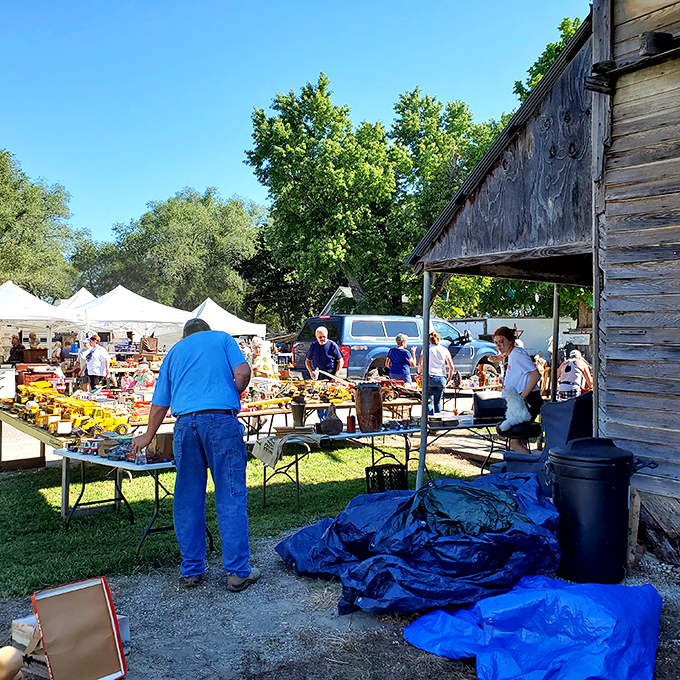 Tables laden with yellow toys catch the Kansas sunshine, while shoppers hunt for that special piece that connects them to childhood memories.