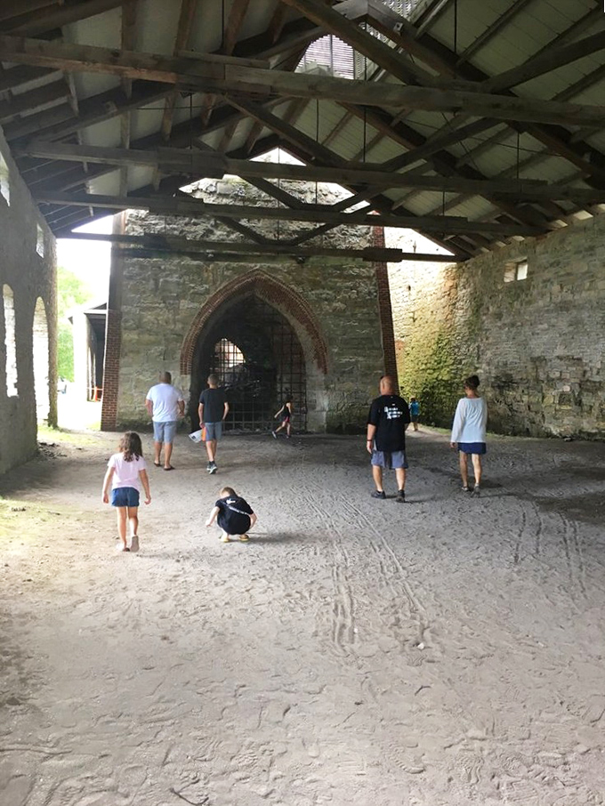 Inside the massive furnace complex, visitors experience the scale of 19th-century industry, where intense heat once transformed raw materials into iron.