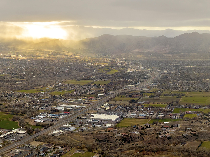 Ca&ntilde;on City from above reveals its perfect positioning&mdash;nestled between mountains and meadows. A golden-hour view of Colorado living that doesn't require a golden bank account.
