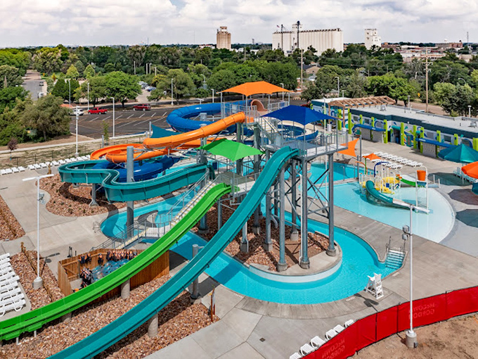 From above, the water park resembles a colorful circuit board of fun, each slide a pathway to joy in the heart of the prairie.