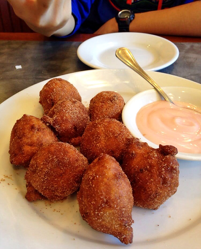 Apple fritters that achieve the impossible: crispy exterior, tender inside, and cinnamon-sugar magic that makes donuts weep with inadequacy.