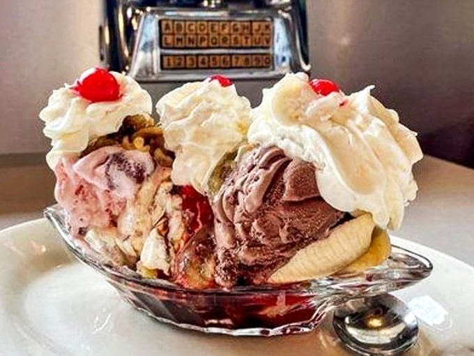 The banana split that launched a thousand food comas. Three scoops of ice cream, whipped cream mountains, and those essential cherries on top.