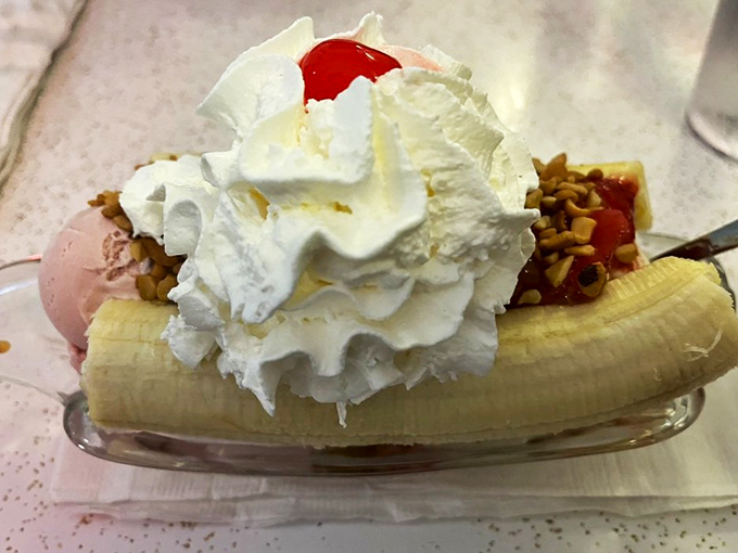 The banana split&mdash;an architectural marvel of whipped cream, cherries, and nostalgia that makes modern desserts seem like they're trying too hard.