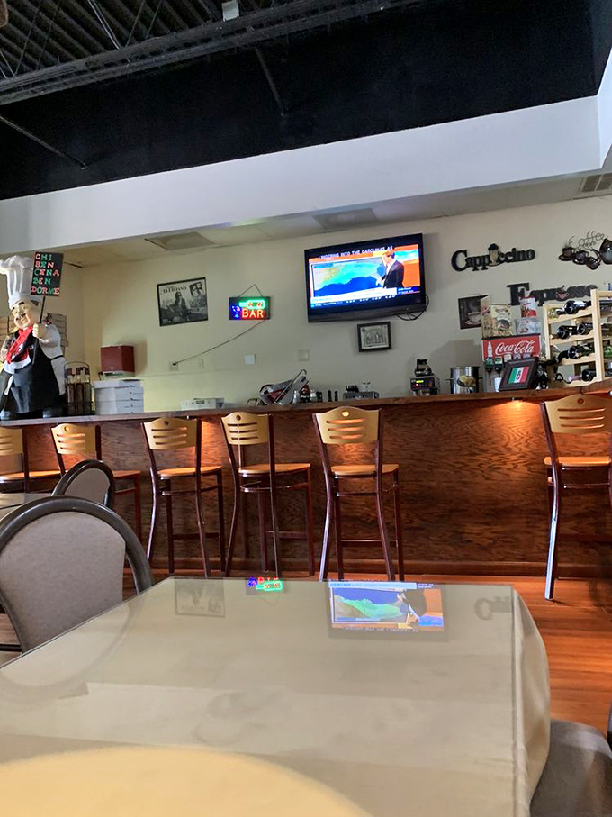 A bar area that says, "Stay awhile, there's tiramisu coming." The perfect backdrop for post-pasta philosophizing.