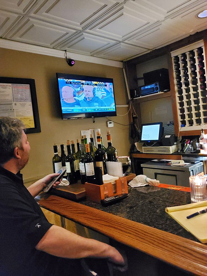 The bar area&mdash;where decisions between Chianti and Montepulciano become life's most pleasant dilemmas while waiting for your table.