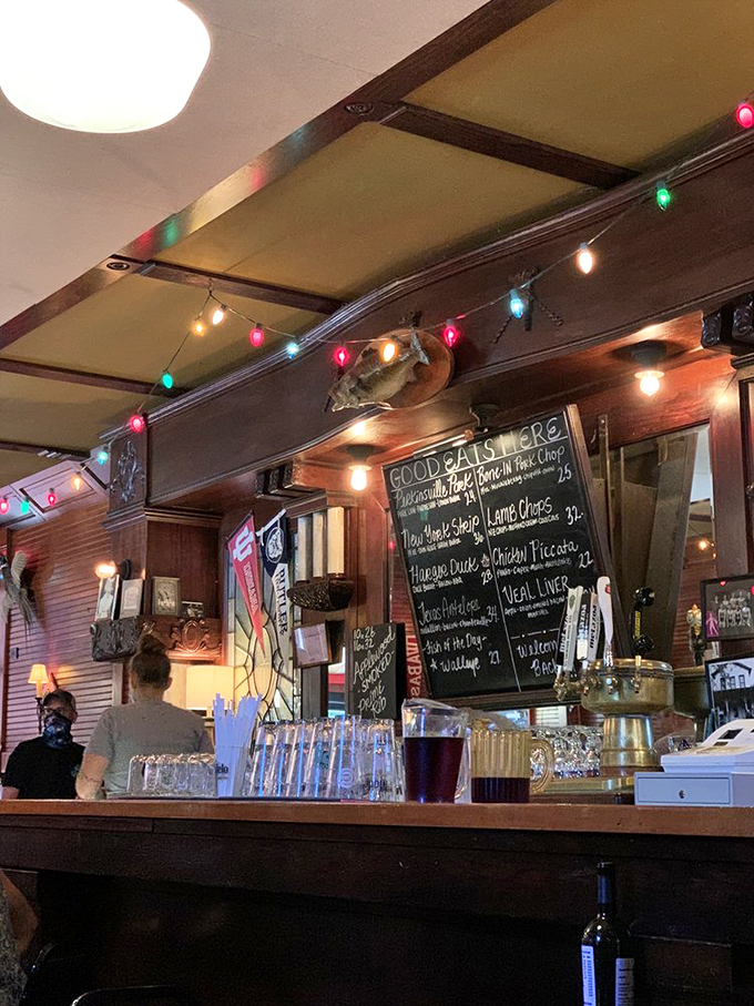 The chalkboard menu changes regularly, but the string lights and mounted fish remain constant. Some traditions are too perfect to change.