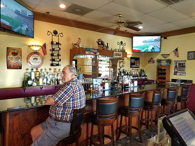 The bar at Ocean Grill: where everybody might not know your name yet, but they will by your second visit. Classic wood, comfortable stools, and conversations waiting to happen.