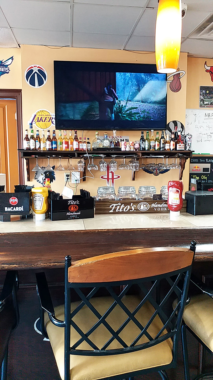 A bar stocked for serious sports watching. Because nothing pairs with smoked meats quite like a cold one and whatever game is on.