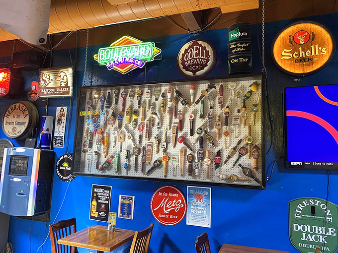 The tap wall displays beer handles like trophies, a colorful testament to Nebraska's impressive brewing scene and Crescent Moon's dedication to craft.