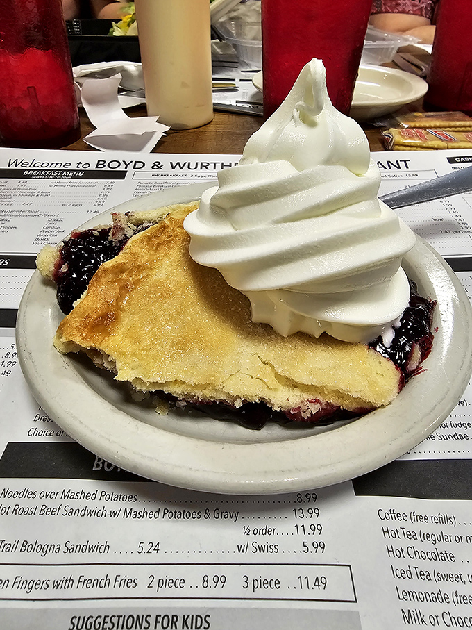 Mile-high blueberry pie topped with cloud-like whipped cream proves that dessert doesn't need reinvention when tradition tastes this good.