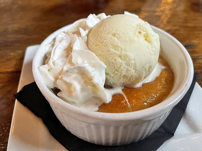 Bread pudding that achieves the impossible: light yet rich, traditional yet surprising, and guaranteed to disappear faster than you planned.