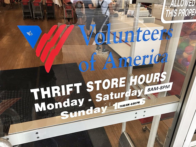 The store hours sign promises eight hours of treasure hunting Monday through Saturday, with a shorter Sunday session for the dedicated.