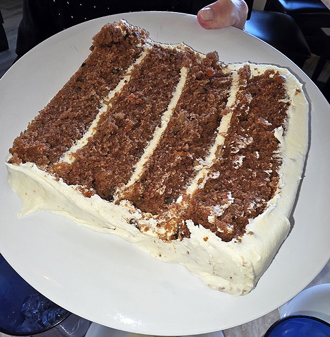 This isn't just carrot cake&mdash;it's a layer cake engineering marvel. Four stories of spiced perfection with cream cheese frosting that dreams are made of.