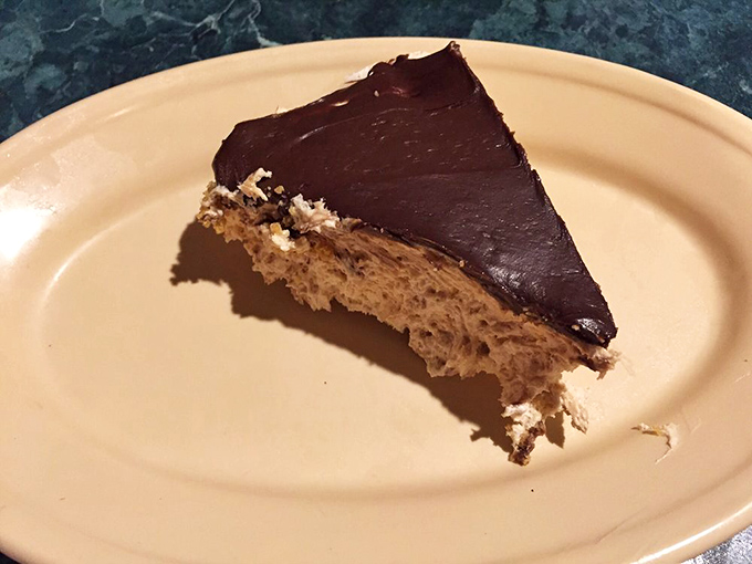 The peanut butter cream pie finale: where chocolate meets peanut butter in a slice that makes sharing feel like a personal sacrifice.