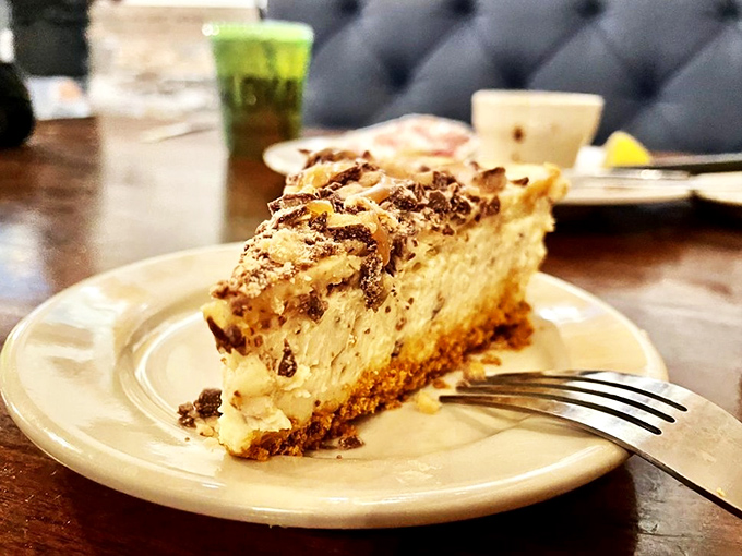 Cheesecake that makes you consider ordering a second slice before finishing your first. That graham cracker crust deserves its own fan club.