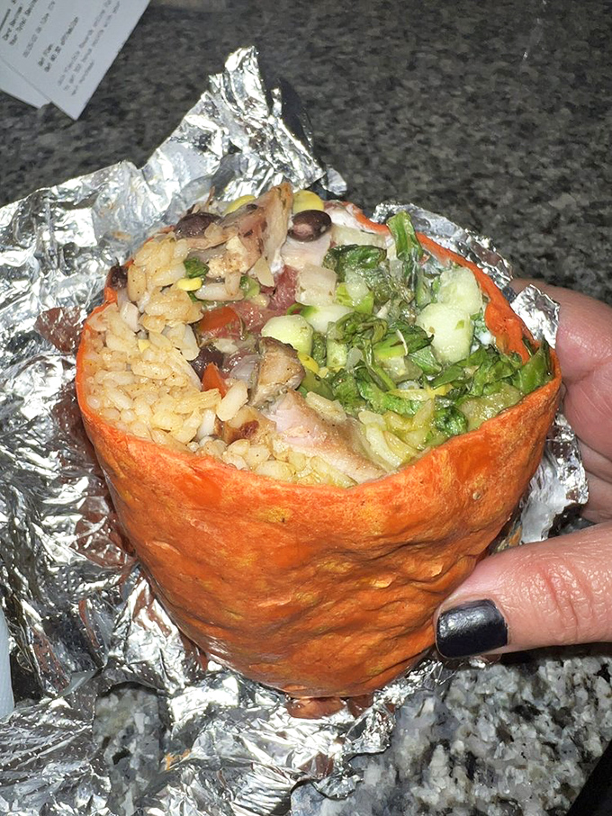 Cross-section of joy. Like geological layers revealing Earth's history, this burrito tells the delicious story of perfect ingredient balance.