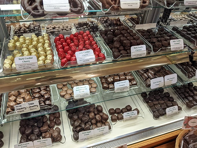 A chocolate lover's dream landscape &ndash; cordial cherries and cream-filled delights waiting patiently behind glass like jewels in a treasure chest.