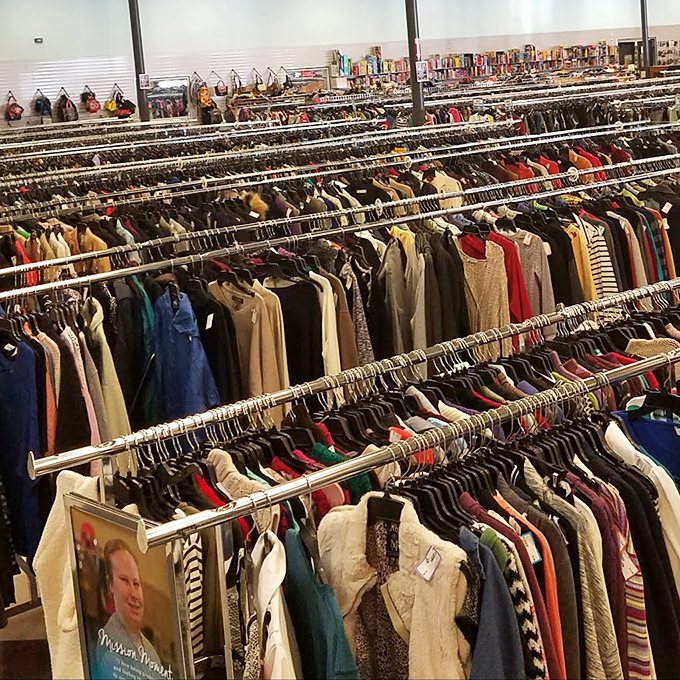 Racks upon racks of possibility. Each garment waits patiently for its second act, like actors at an audition hoping for their big break.